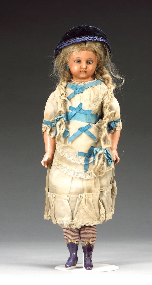 Bonhams : Wax over composition shoulder head doll, German circa 1870