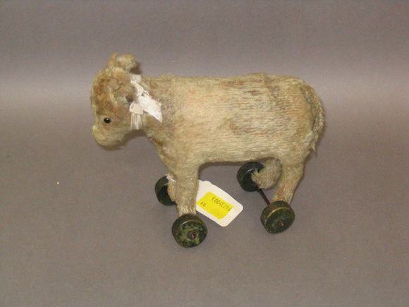 Bonhams : Steiff cow on wheels circa 1920