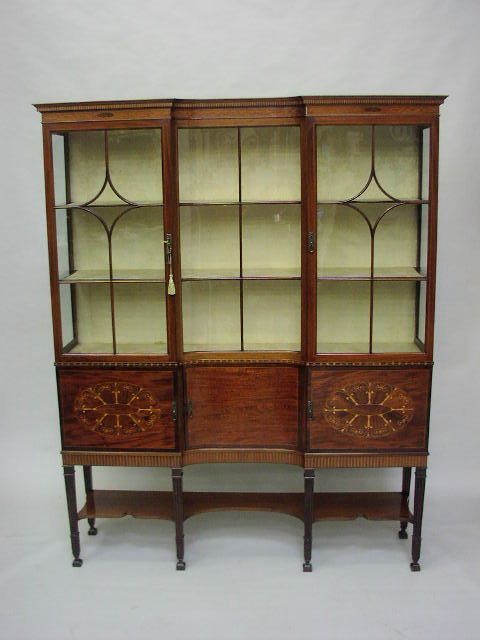 Bonhams : An Edwardian mahogany and inlaid inverted breakfront display ...