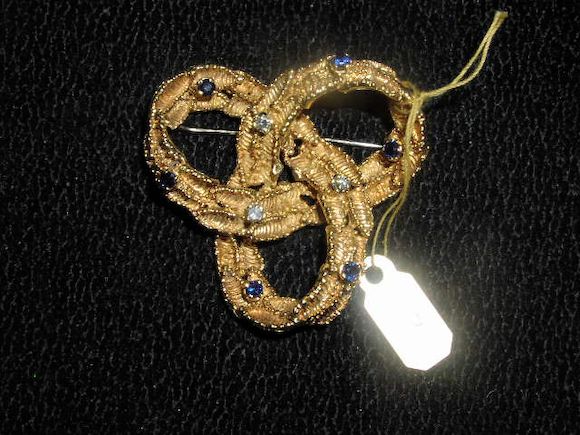 Bonhams : An 18 carat gold sapphire and diamond interlocking trefoil brooch