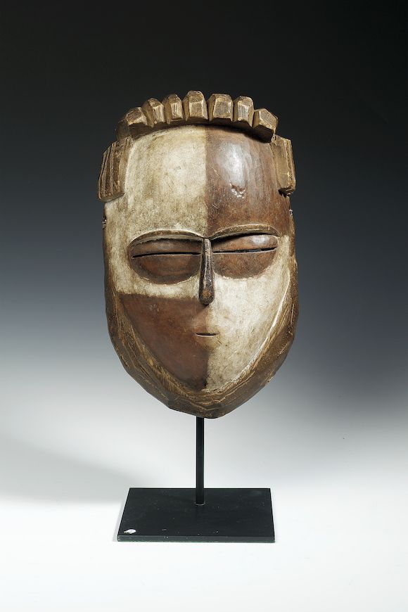 Bonhams : A Vuvi mask 31cm., with stand