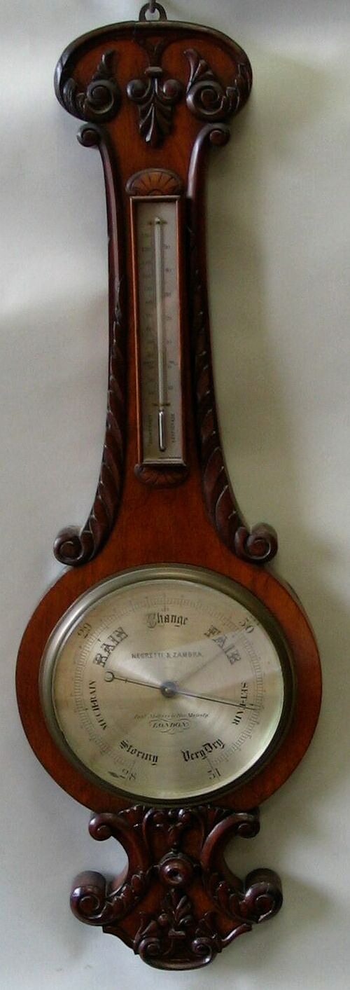 Bonhams : A Victorian walnut banjo type barometer,