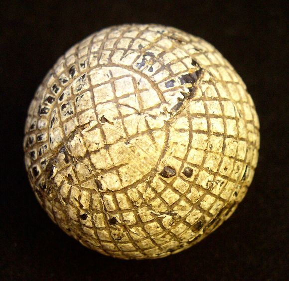 Bonhams : An un-named early moulded mesh gutty ball C. 1880s,