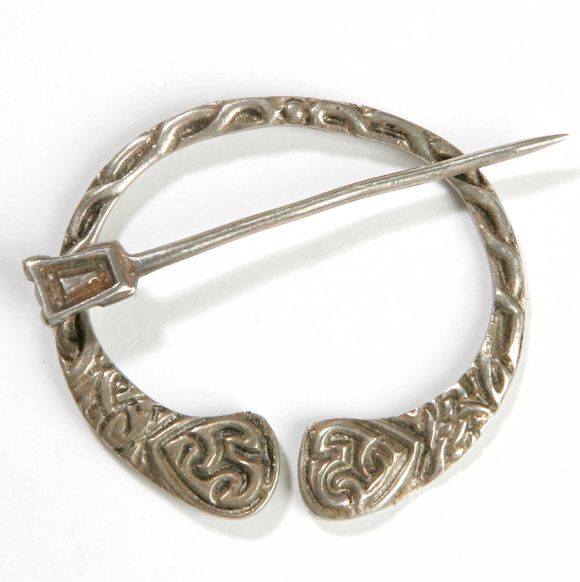 Bonhams : A silver pennanular Brooch,