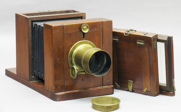 Bonhams : Early Bellows camera quarter plate in polished mahogany and ...