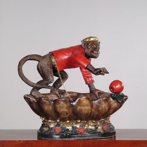 Bonhams : A pair of decorative carved wood monkeys and clam shells