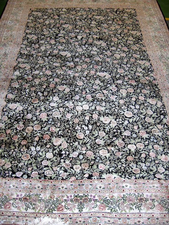 Bonhams : A Ghom silk carpet Central Persia, 281cm x 183cm