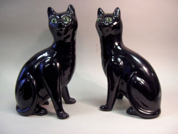 Bonhams : A pair of Tooth and Co. (Bretby) pottery cats,