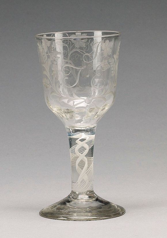 Bonhams : An engraved opaque twist goblet, circa 1765,