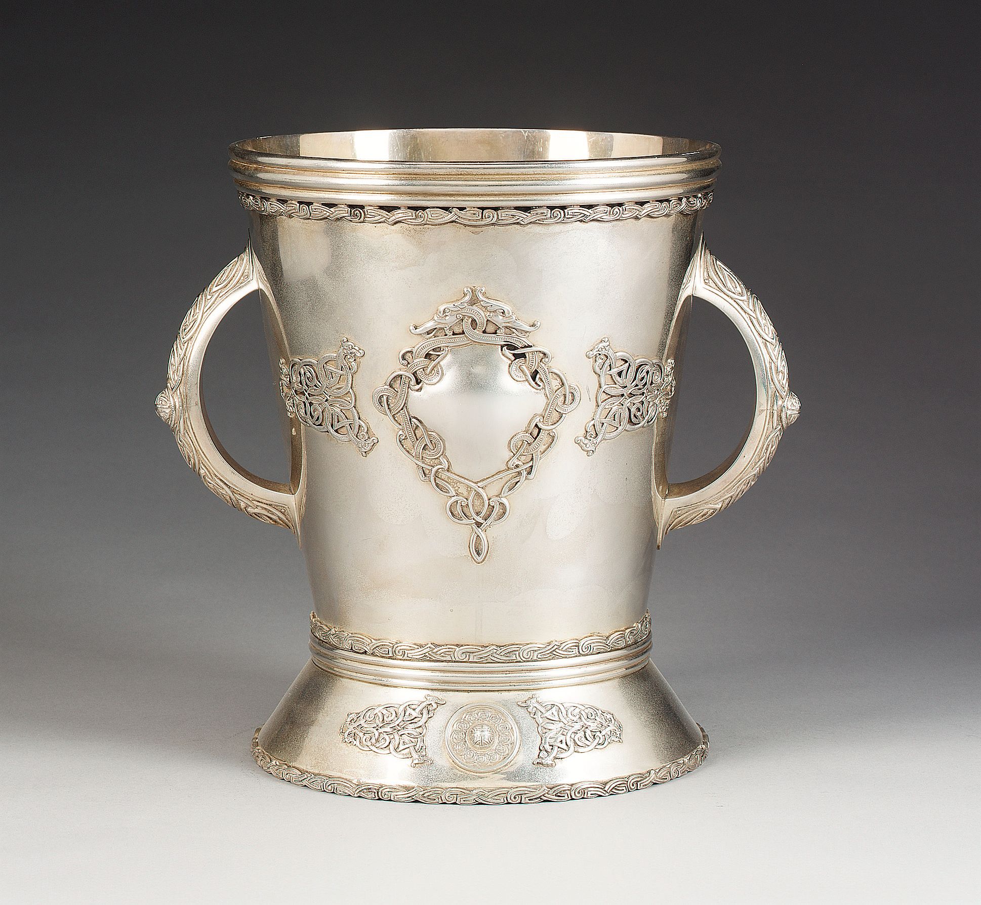 STUART DEVLIN : An extensive hand forged silver and silver-gilt round ...