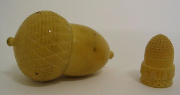 Bonhams : A vegetable ivory thimble case and thimble,