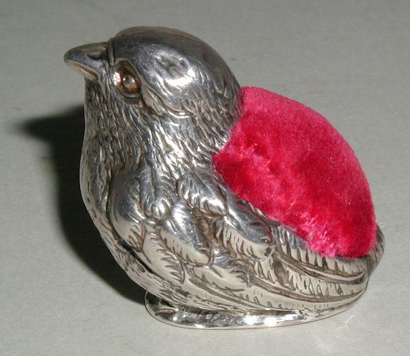 Bonhams : A silver chick form pincushion,