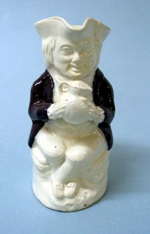 Bonhams : A small cross legged toby jug circa 1850,