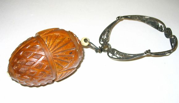 Bonhams : An early 19th century carved coquilla nut thread ball holder