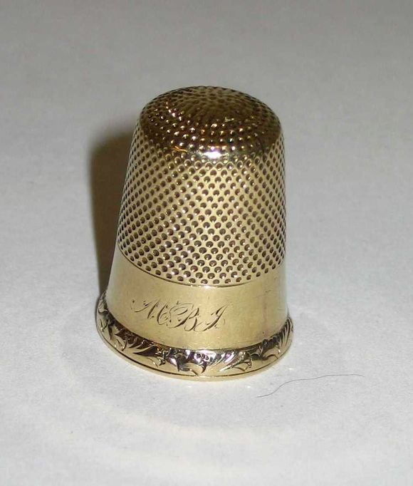 Bonhams : A mid-19th century gold thimble,