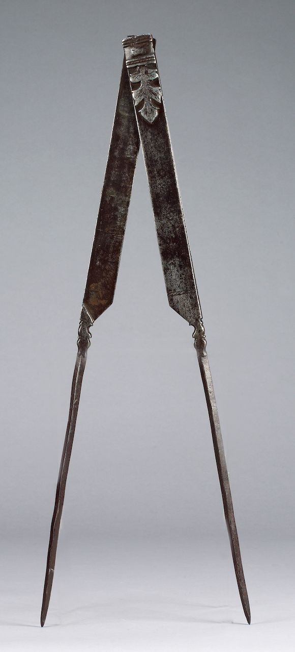 Bonhams : A large pair of mason's iron dividers, European, 17th century,