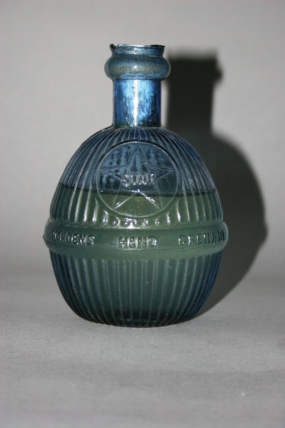 Bonhams : A light blue glass Star fire grenade bottle