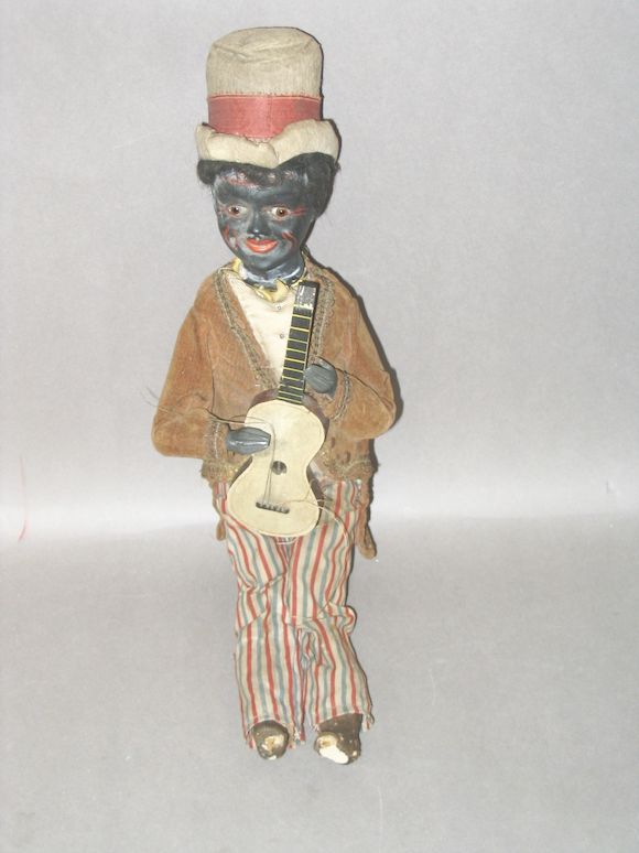 Bonhams : Black bisque head Banjo player squeeze toy, German circa 1910