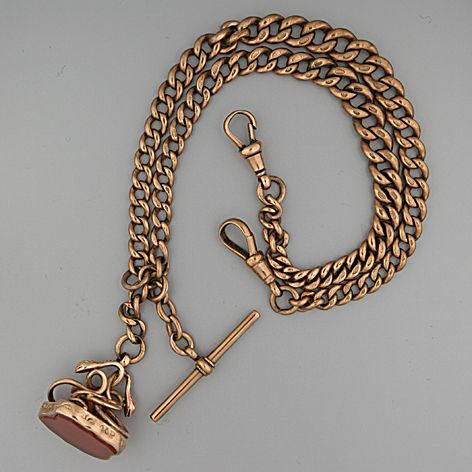 Bonhams : A 9 carat gold graduated curb-link double watch albert