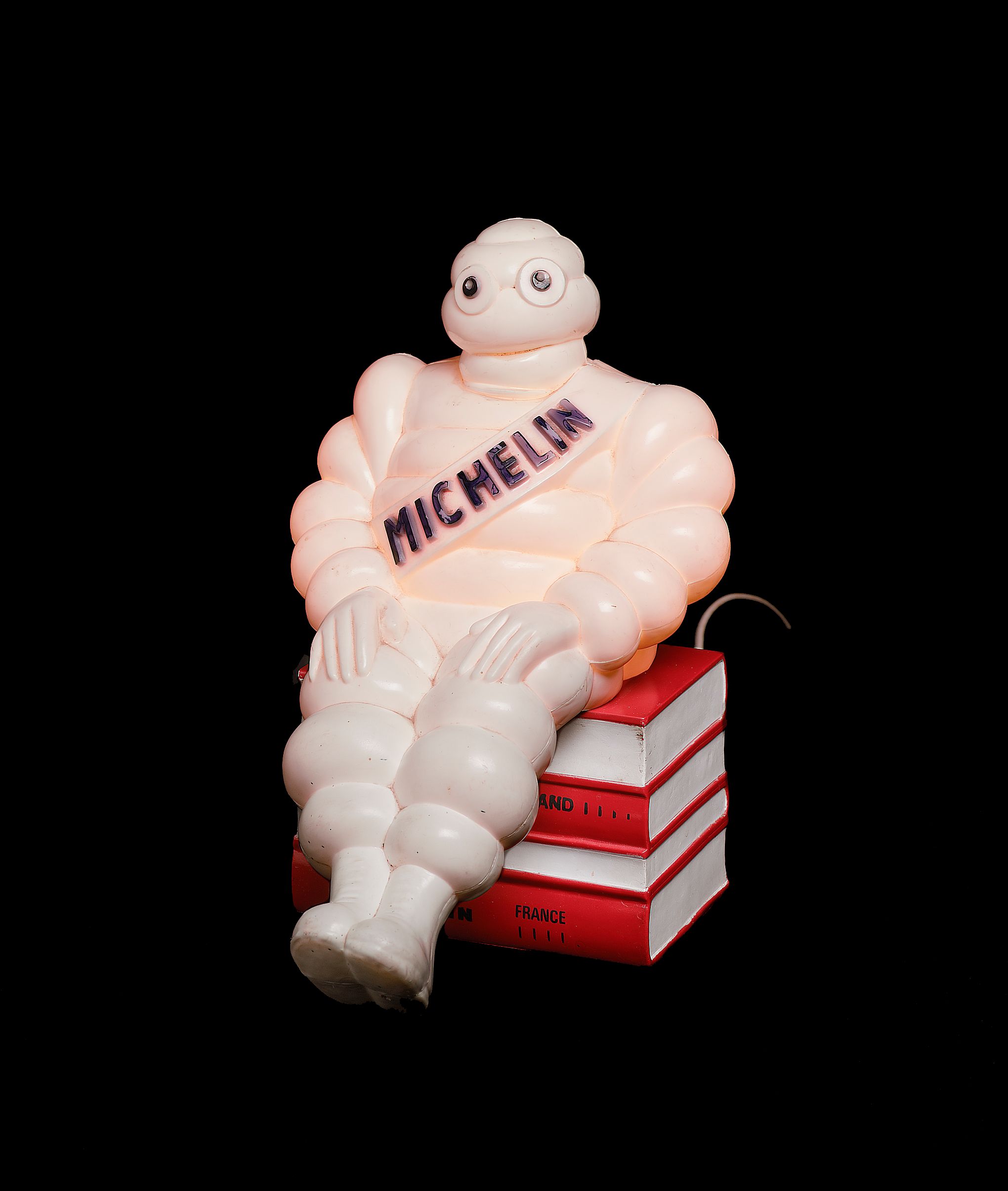 Bonhams Cars : A rare Mr Bibendum Guidebook lamp,