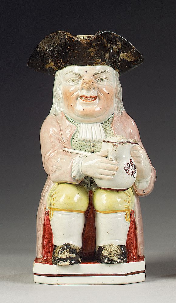 Bonhams : An enamelled pearlware Toby jug, circa 1830,
