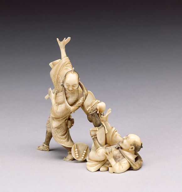 Bonhams : An animated stained ivory okimono,