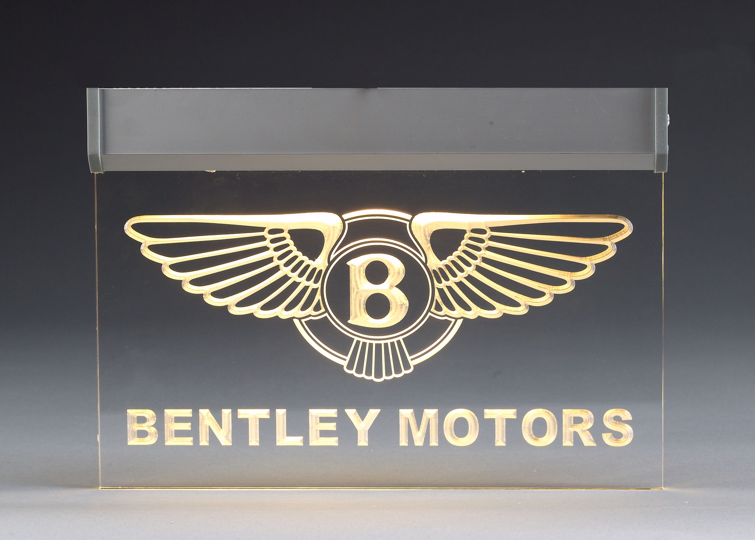 Bonhams Cars : A good small Bentley Motors illuminated sign,
