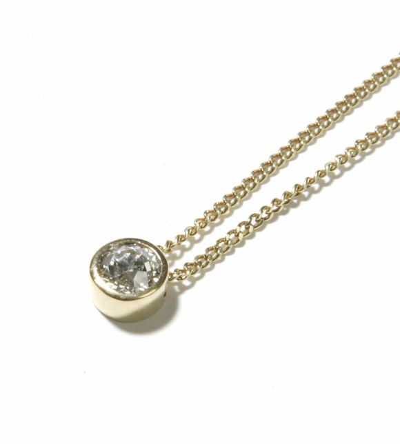 Bonhams : A diamond single-stone pendant on trace-link chain