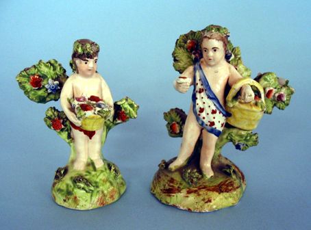 Bonhams : Two Staffordshire creamware figures of scantily clad putti ...