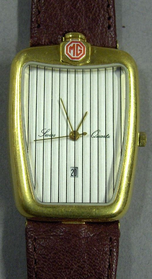 Bonhams Cars : An MG grille watch with leather strap,