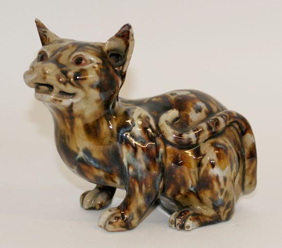 Bonhams : A treacle glazed model of a cat