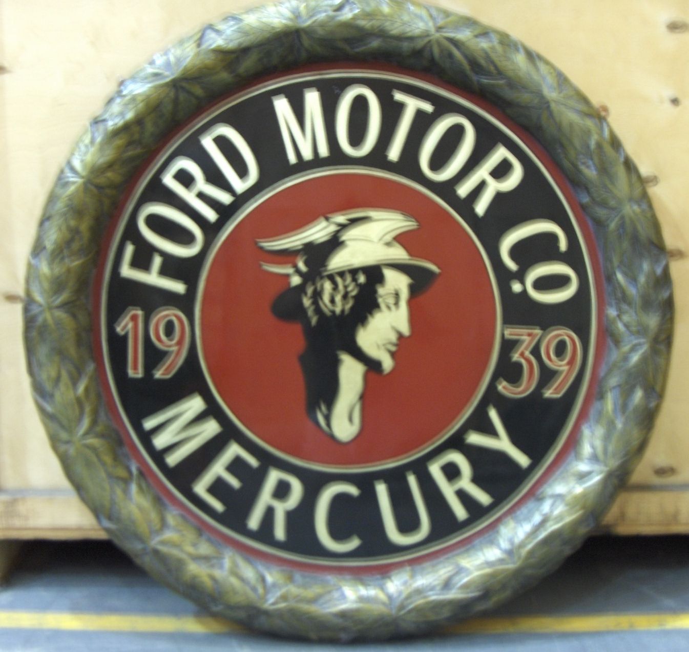 Bonhams Cars : A hand painted roundel with raised laurel edging and ...