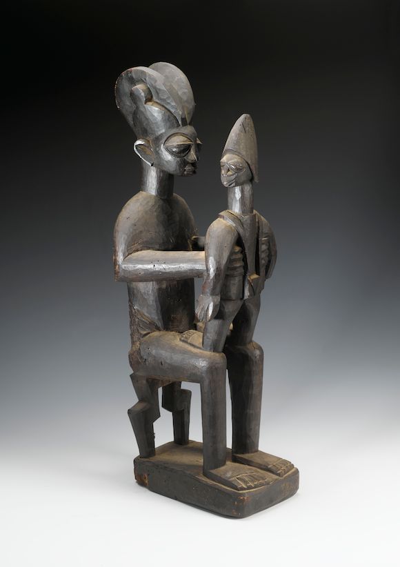 Bonhams : A Yoruba wood figure of a mother and child 67cm.