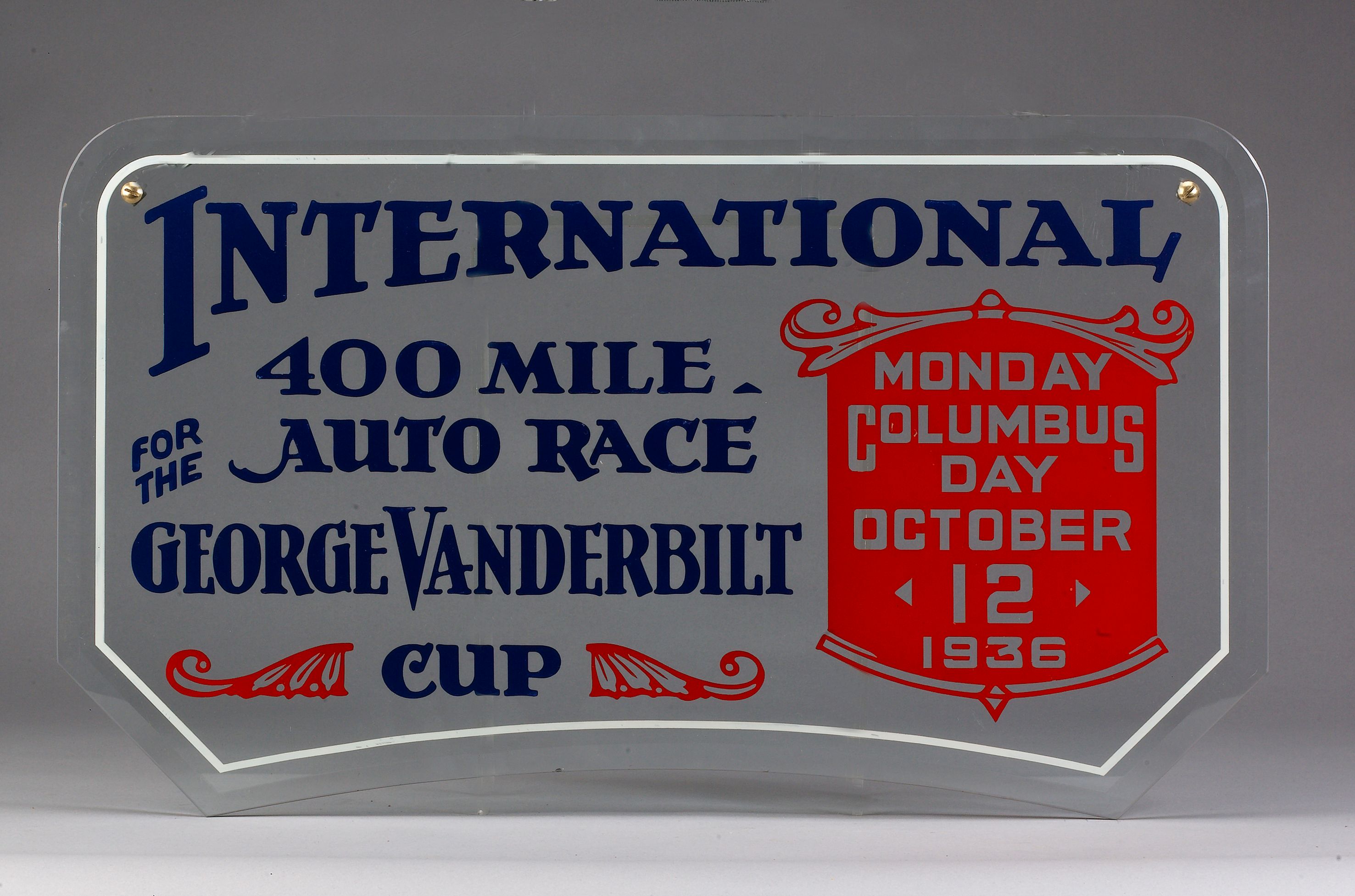 Bonhams Cars : A George Vanderbilt Cup glass advertising sign, 15 x 24in