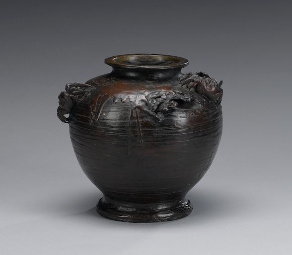 Bonhams : A bronze oviform vase designed as the habitat for a frog and ...