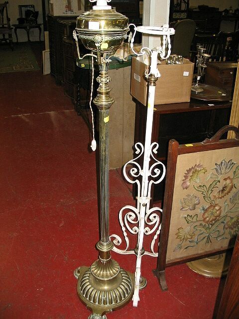 Bonhams : A 19th Century brass floor standing oil lamp frame