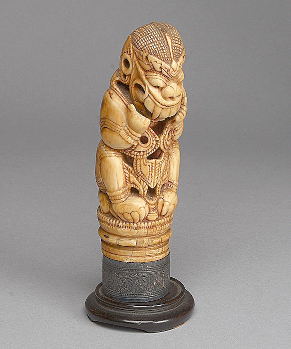 Bonhams : A 19th Century Oriental carved ivory cane or dagger handle