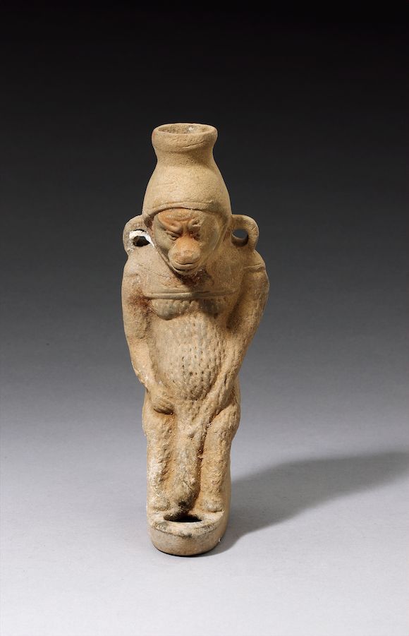 Bonhams : A Roman terracotta lamp in the shape of a monkey