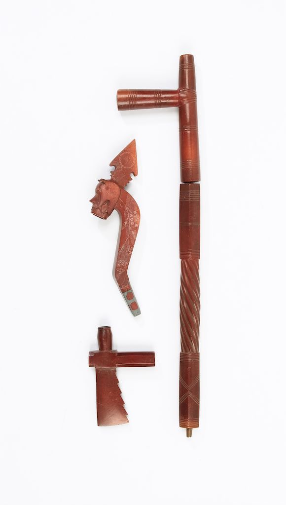 Bonhams : A Chippewa red catlinite pipe and stem approx. 57.5cm. long