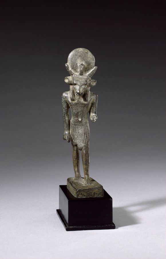 Bonhams : An Egyptian bronze striding figure of Mnevis