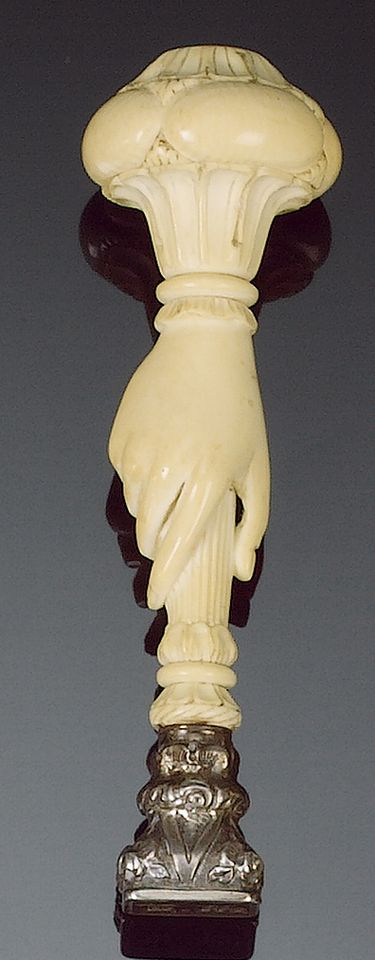 Bonhams : A Victorian ivory and silver mounted seal-in-hand table seal,