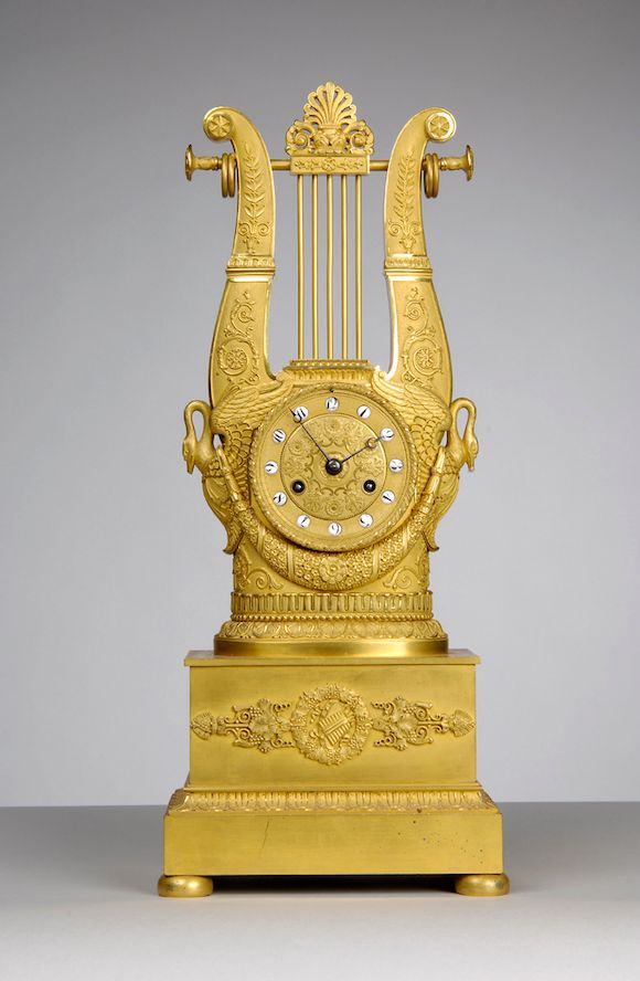 Bonhams : A gilt metal French lyle shaped mantel clock