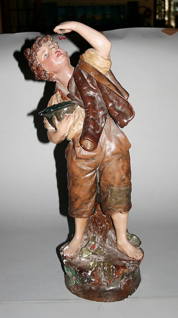 Bonhams : A large Continental plaster figure of a boy eating cherries ...