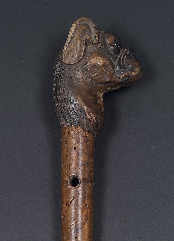 Bonhams : Two carved wooden dog parasol handles,