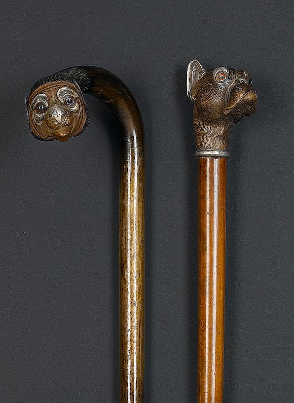 Bonhams : A carved wooden and silver mounted monkey walking stick,