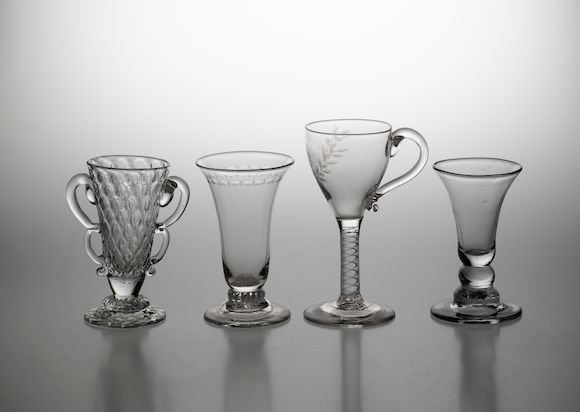 Bonhams : A rare double-handled moulded syllabub glass circa 1730