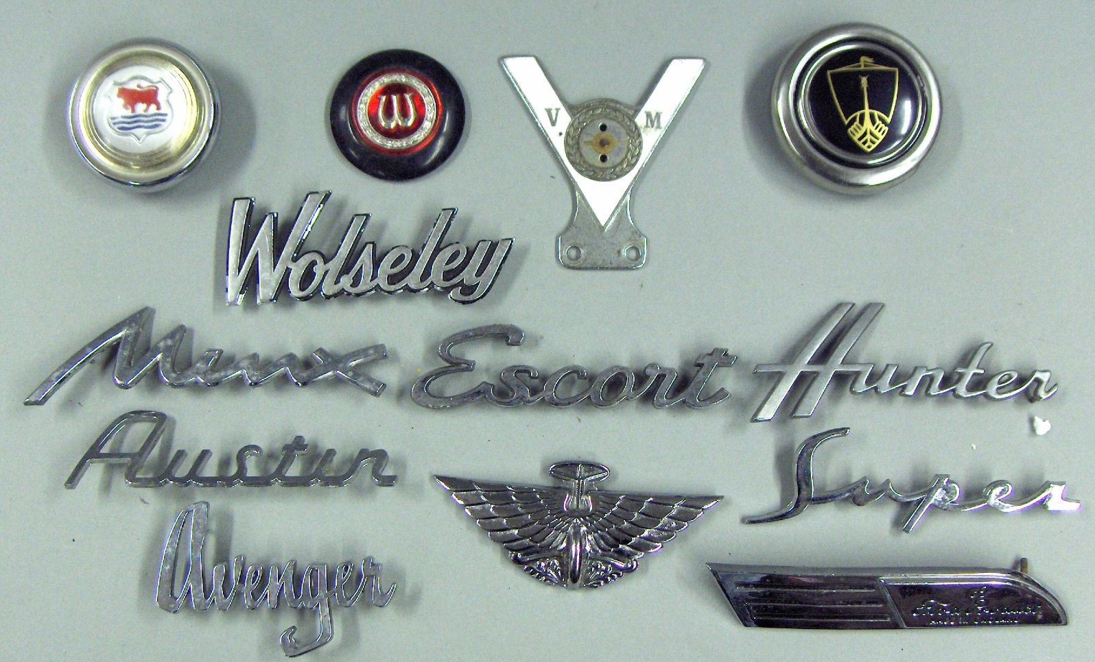Bonhams Cars : A quantity of Motorcar badges and scripts,