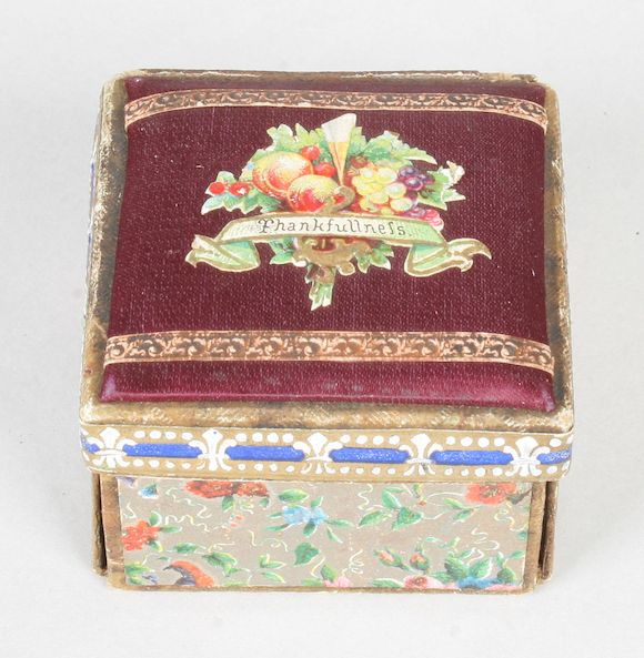 Bonhams : A cardboard needle box with padded lid
