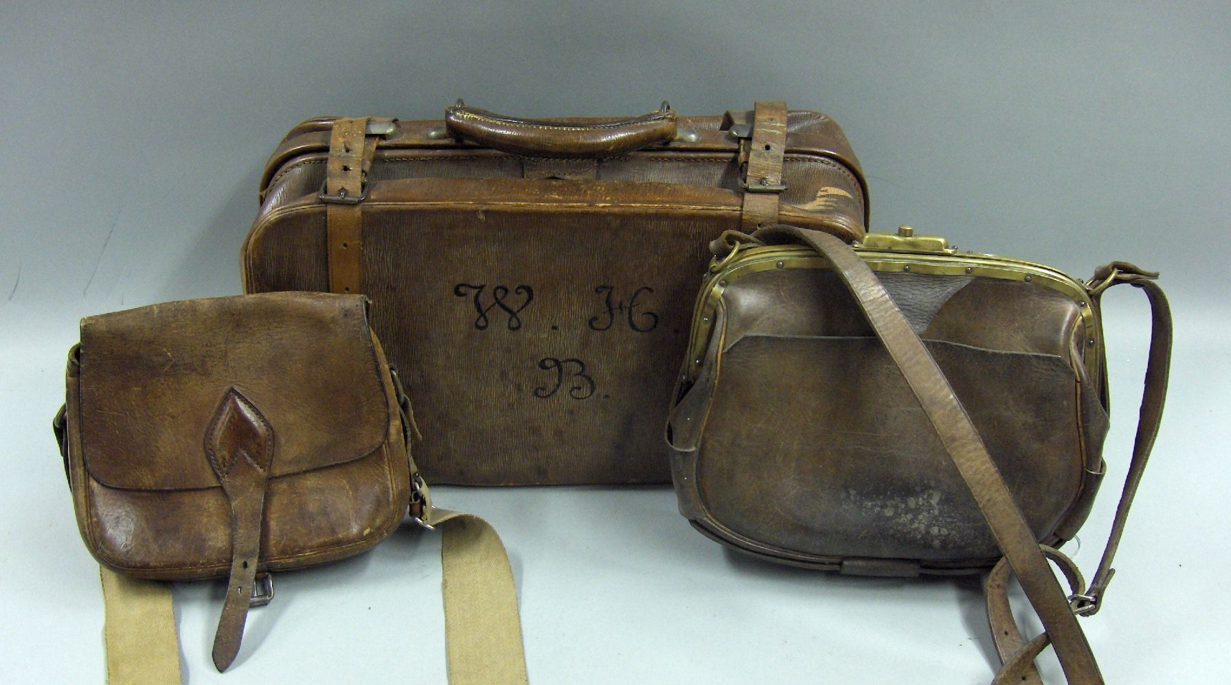 Bonhams Cars : Three good brown leather bags,