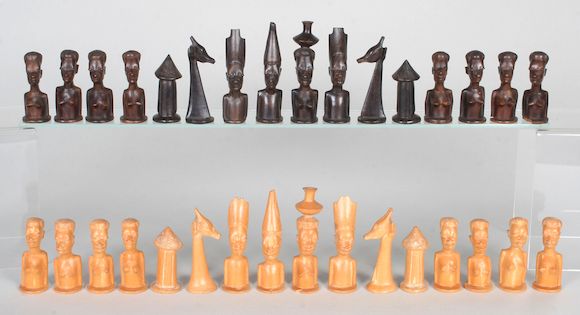Bonhams : A post World War II Kenyan hardwood bust chess set
